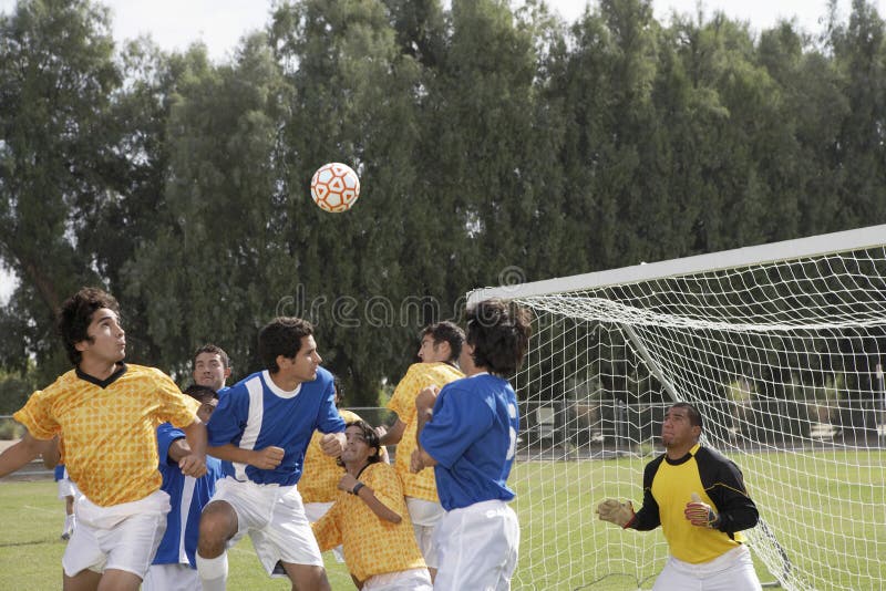Players Playing Soccer on Field Stock Image - Image of rivalry, hitting ...