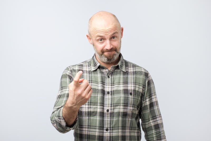 Playful Adult Showing Come Here Gesture with Index Finger and Smiling ... Playful Adult Showing Come Here Gesture with Index Finger and Smiling ...