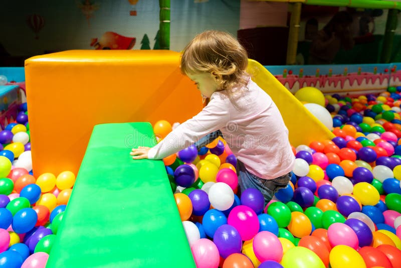 Playful Child Exploring Soft Structures Colorful Ball Pit Vibrant ...