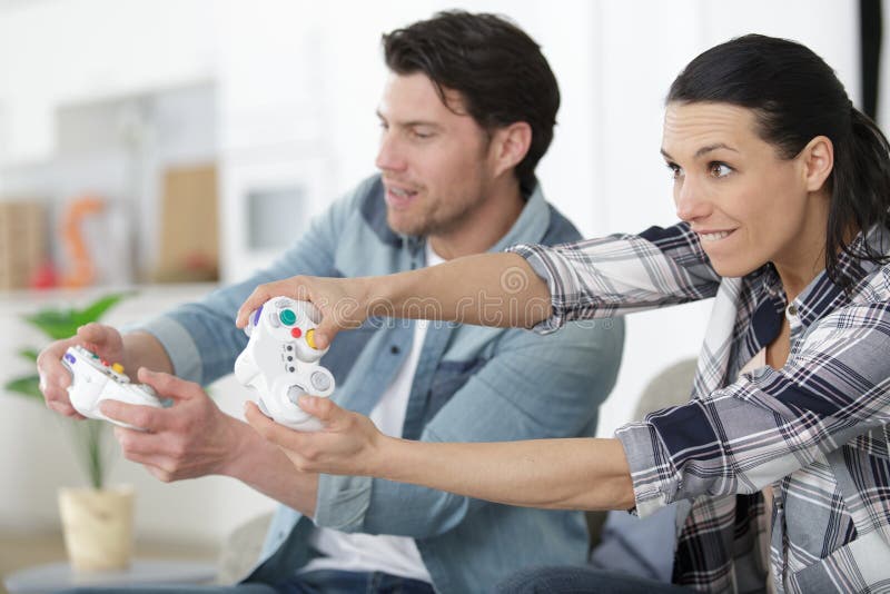 Playful Couple Playing Video Games Together Stock Image - Image of ...