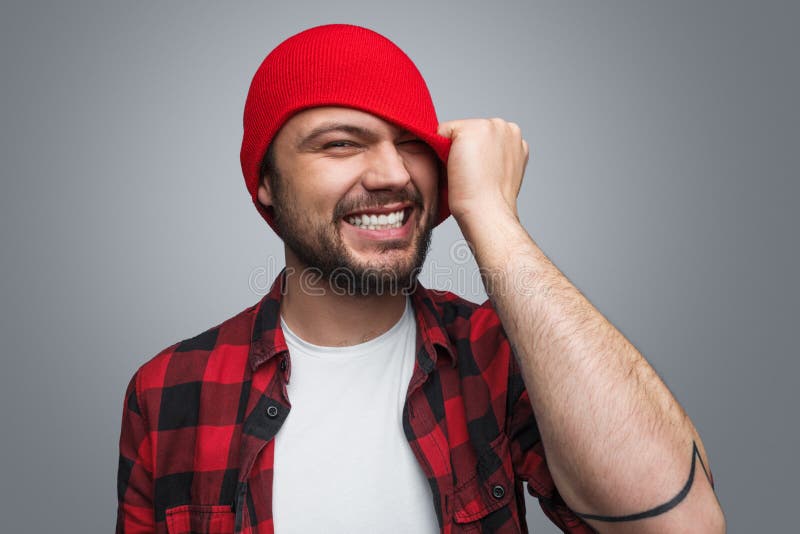 Playful Guy in Red Hat and Shirt Stock Photo - Image of posture, joyful ...