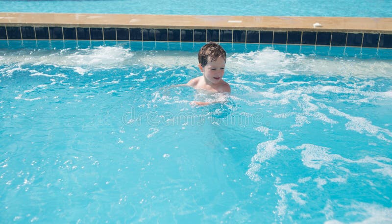 Playful Little Boy Splash in Swimming Pool. Resort Stock Photo - Image ...