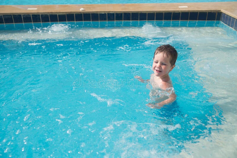 Playful Little Boy Splash in Swimming Pool. Resort Stock Photo - Image ...