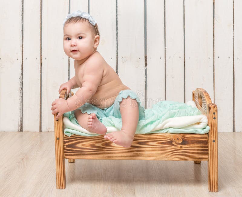 Playful Little Child Sitting on a Cot Stock Image - Image of caucasian ...