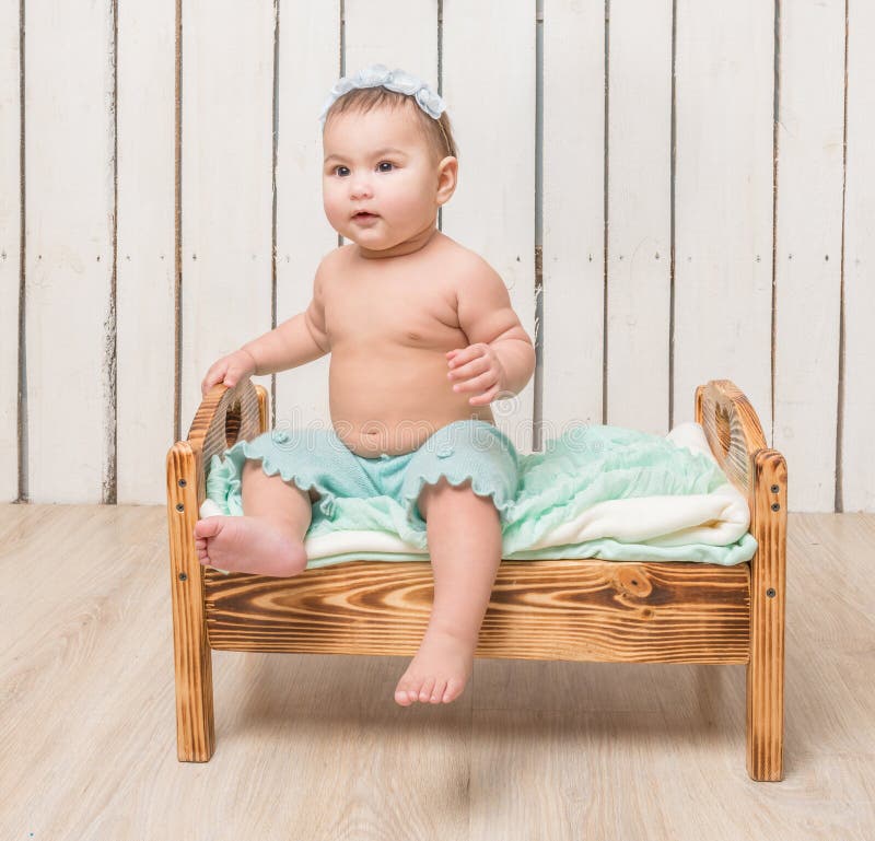 Playful Little Child Sitting on a Cot Stock Photo - Image of sweet ...