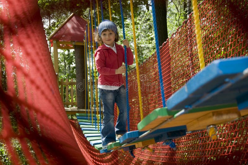 Child on playground bridge stock image. Image of slat - 5769517