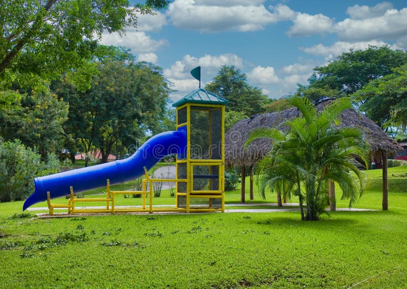 Playground with Blue Slide in Tropics Stock Photo - Image of park ...