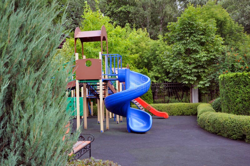 Playground for Children in the Park among the Green Trees Stock Photo ...