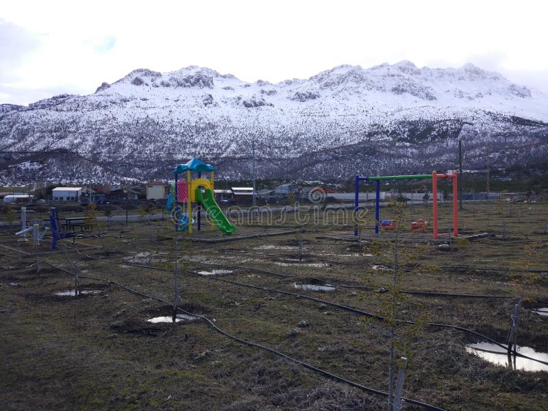 The Playground at the Mountains Stock Image - Image of bench, building ...