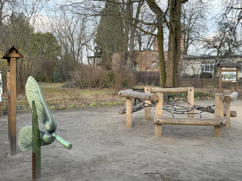 A Playground in the Park with an Interactive Board about Trees and ...