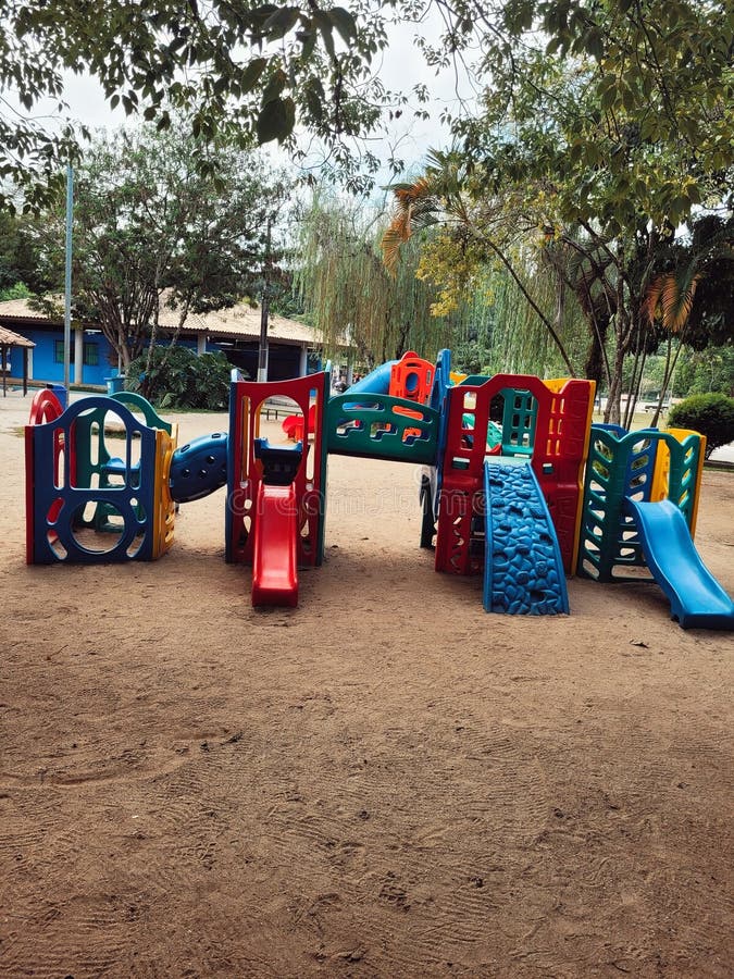 Playground in a Park Surrounded by Trees Stock Image - Image of trees ...