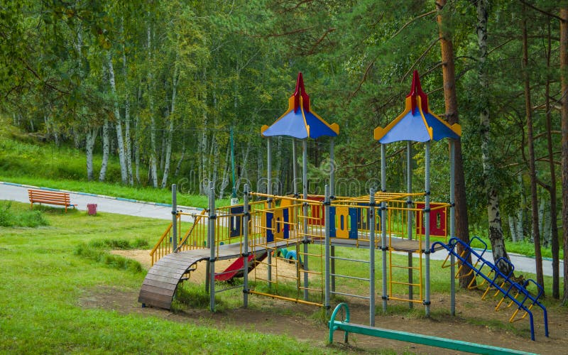 Playground in the Park among the Trees Stock Image - Image of colorful ...