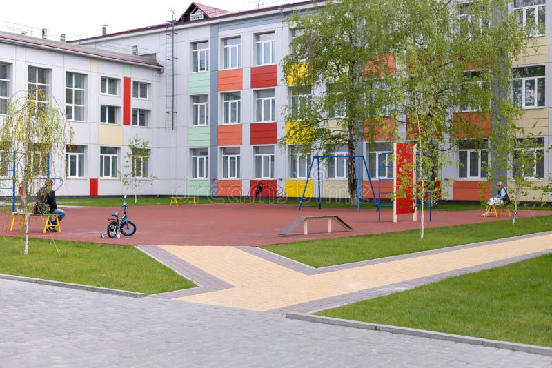 Playground in the School Yard Stock Photo - Image of blue, grass: 218514004