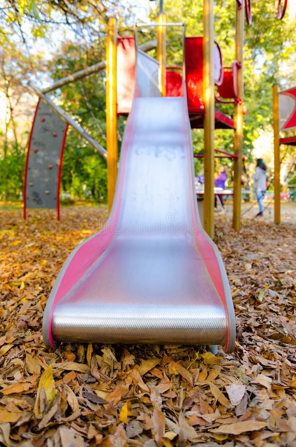 Playground Slides in the Park Stock Image - Image of yellow, cradle ...