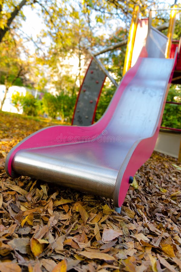 Playground Slides in the Park Stock Photo - Image of trees, fall: 45974244