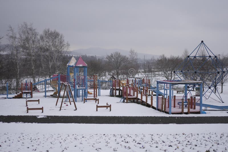 Playground in Snowy Winter Setting Stock Photo - Image of trees ...