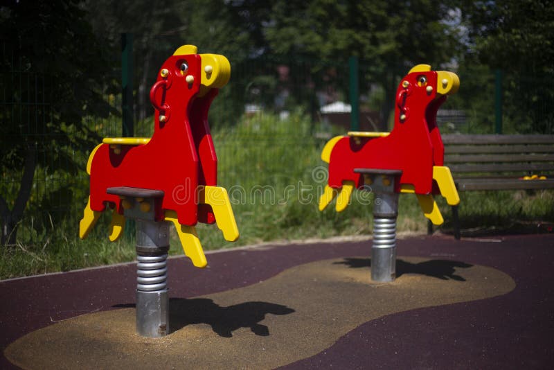 Playground. Spring Horses on the Playground Stock Image - Image of ...