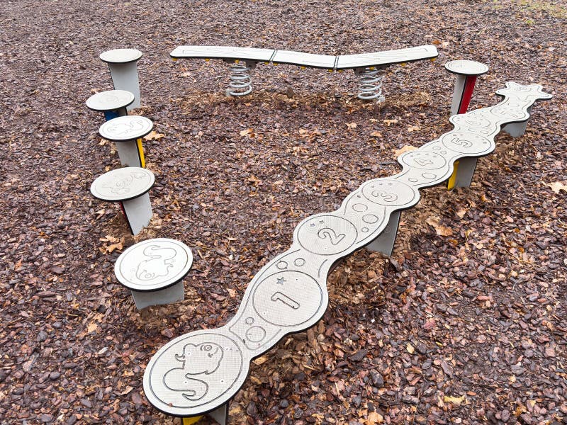 Playground Stepping Stones and Spring Balance Beam on Mulch Stock Photo ...