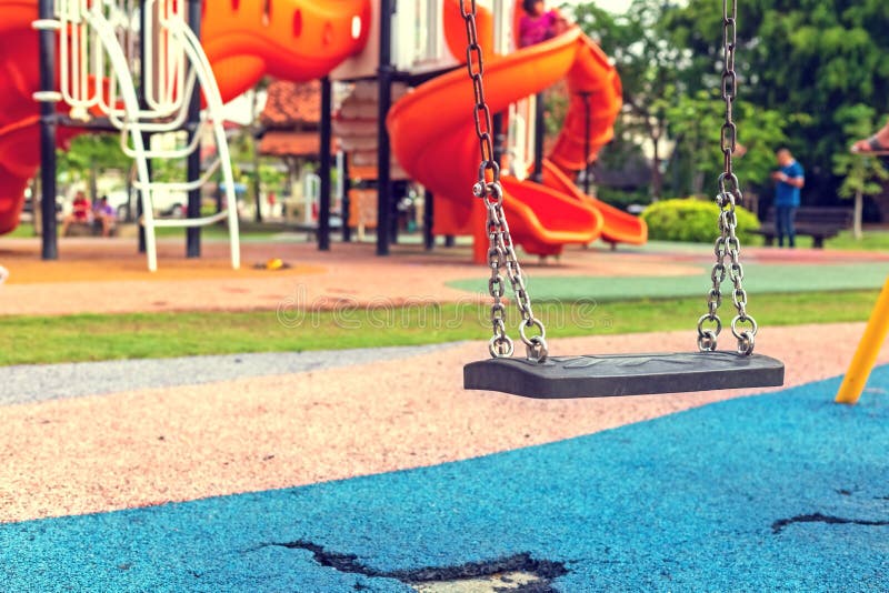 Playground swing in a park stock photo. Image of activity - 172582300
