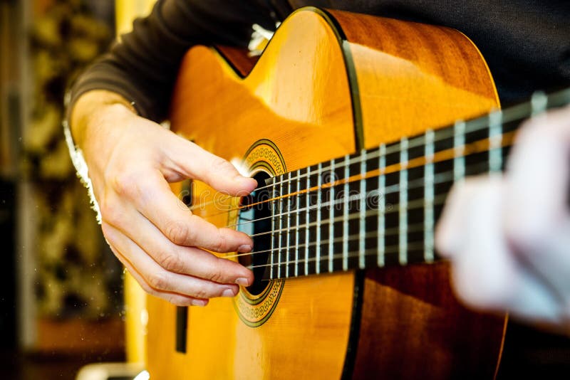 Playing an acoustic guitar stock photo. Image of cowboy - 66344906