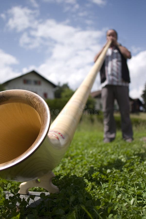 Playing the alphorn stock image. Image of valais, depth - 2649809