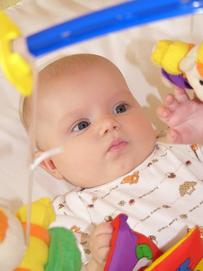 Baby playing with toys stock image. Image of families - 1899089