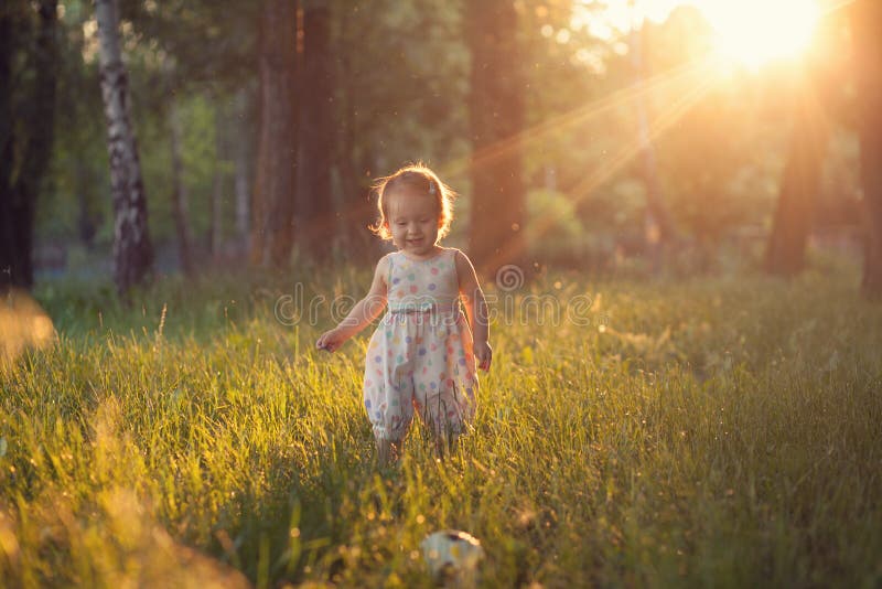 Playing Baby in Sunset Lights Stock Image - Image of childhood ...