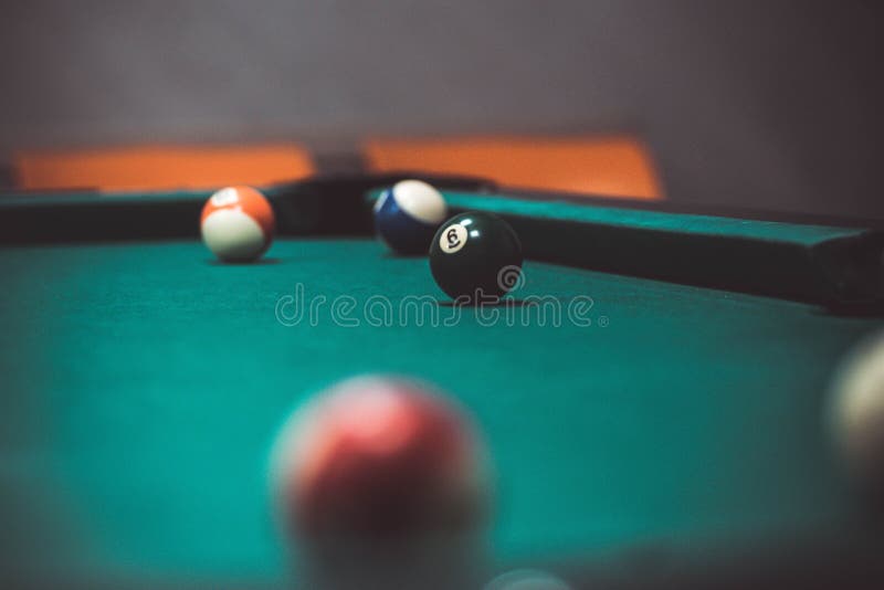 Playing biliard in a pool stock image. Image of club - 234281623