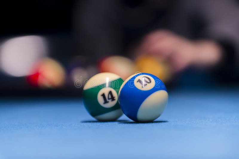 Playing Billiard. Billiards Balls and Cue on Blue Billiards Tabl Stock ...