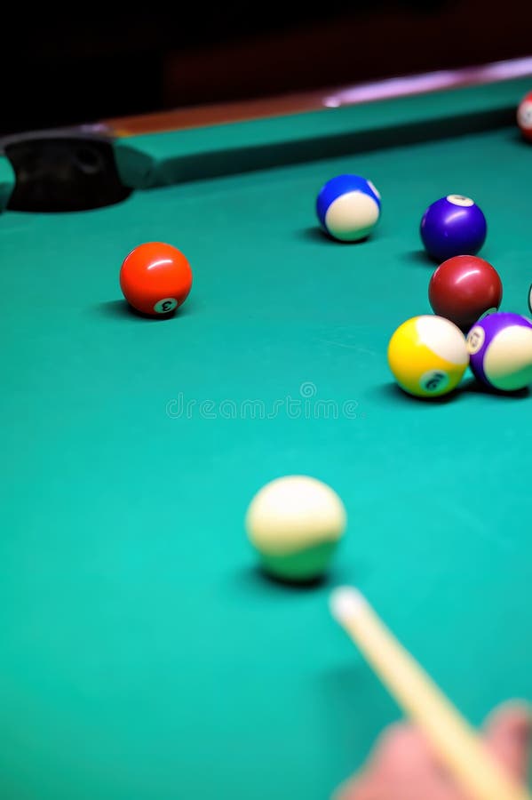 Playing Billiards on a Green Table. a Close-up of a Billiard Ball that ...