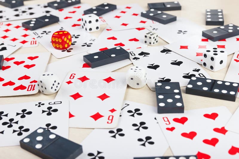 Playing Cards, Dominoes and Dice for Board Games on Light Table Close ...