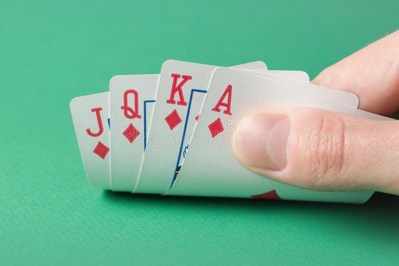 Playing Cards in Hand on Green Background Stock Photo - Image of casino ...
