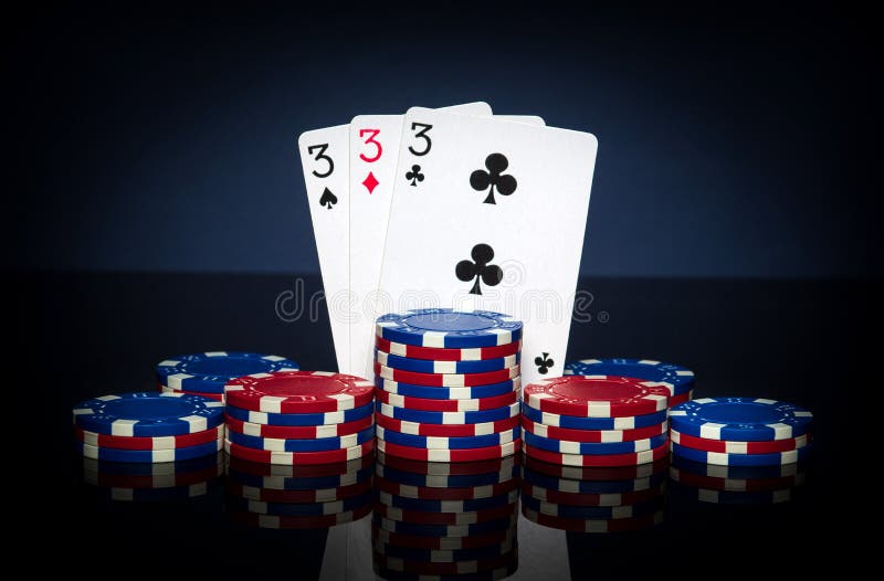 Playing Cards in Poker Game with Three of Kind or Set Combination ...