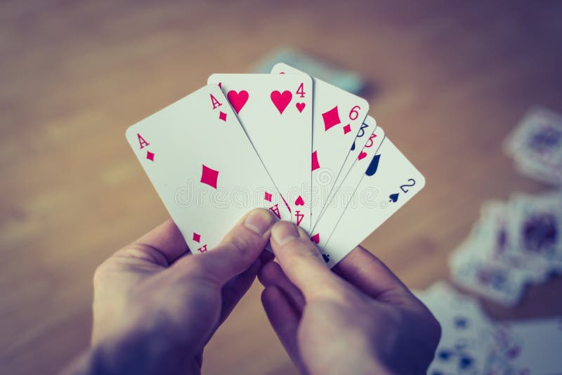 Playing Cards: Poker Cards in the Hand of a Young Man Stock Photo ...