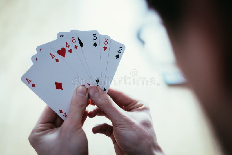 Playing Cards: Poker Cards in the Hand of a Young Man Stock Image ...