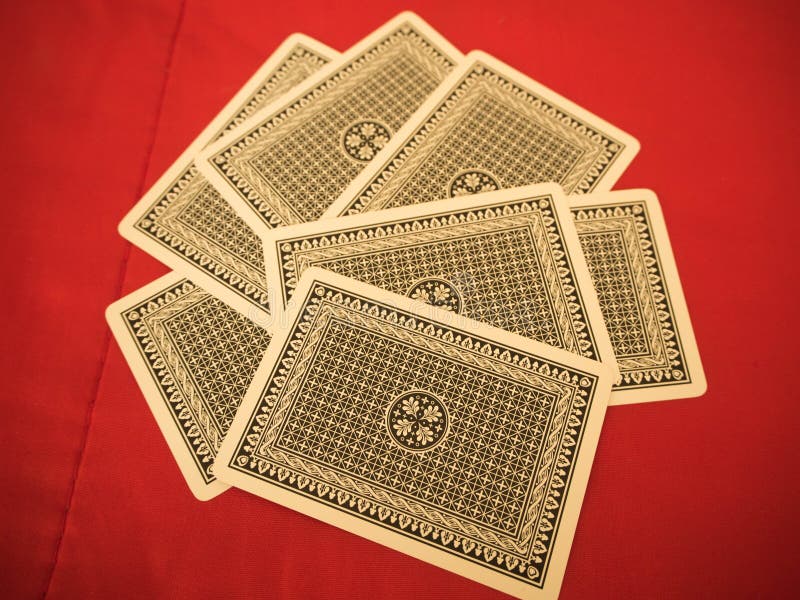 Playing cards on red table stock photo. Image of isolated - 88391112