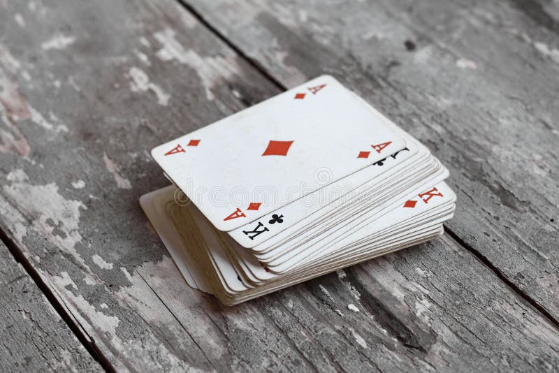 Playing Cards on a Rustic Wooden Table. Stock Image - Image of club ...