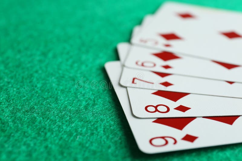 Playing Cards with Straight Flush Combination on Green Table, Closeup ...