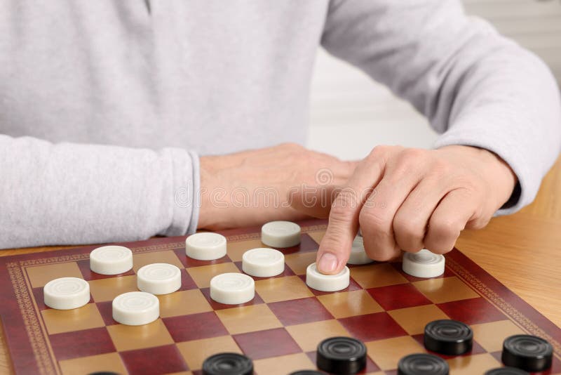 Playing Checkers. Senior Man Thinking about Next Move at Table, Closeup ...
