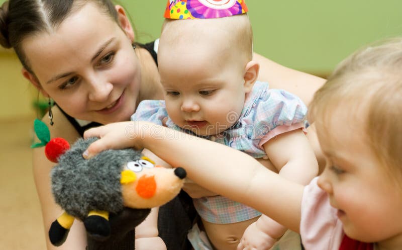 Playing children with mum stock image. Image of females - 4590903