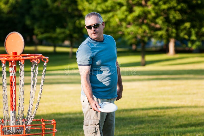 Playing disc golf stock photo. Image of basket, leisure - 55424992