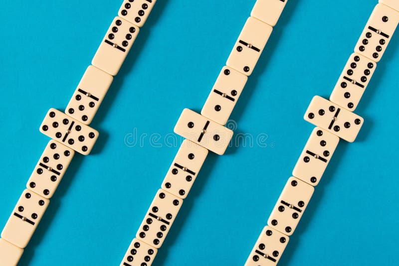 Playing Dominoes on a Blue Table. Domino Effect Stock Image - Image of ...
