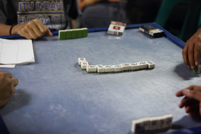 Playing Dominoes on Round Table Stock Image - Image of round, think ...