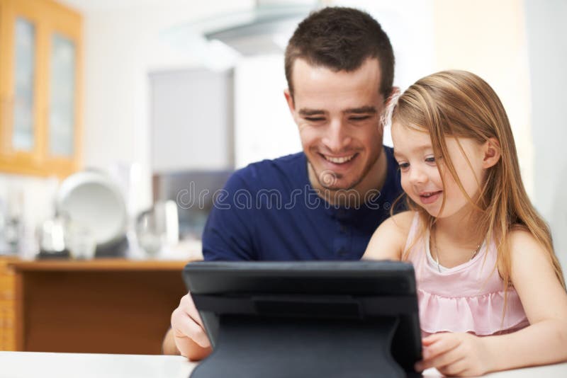 Playing an Educational Computer Game. a Father and Daughter Playing a ...