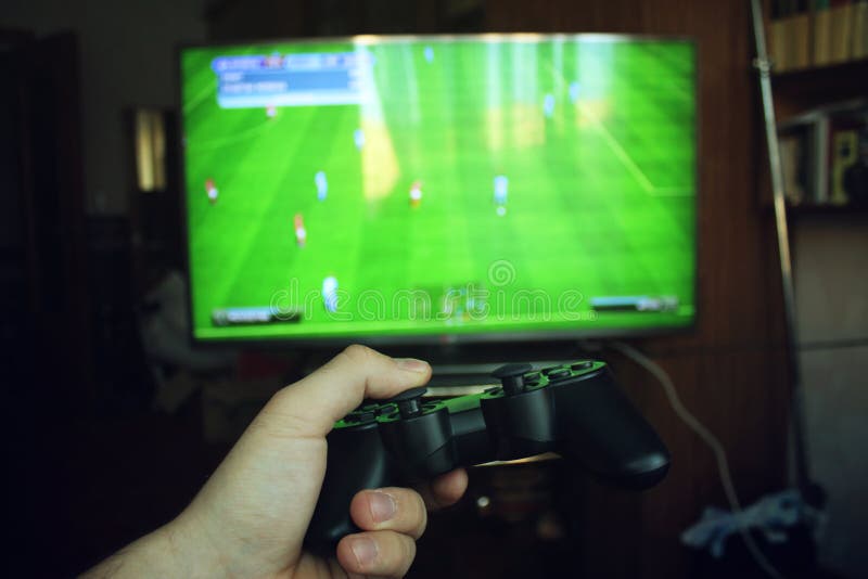 Playing Football with the Joystick on the Game Console Stock Image ...