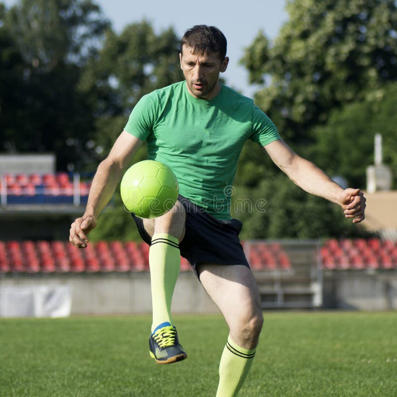 Playing football player stock photo. Image of shot, active - 86254106