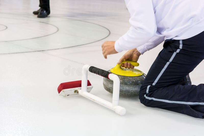 Playing a game of curling. stock photo. Image of indoor - 91129478