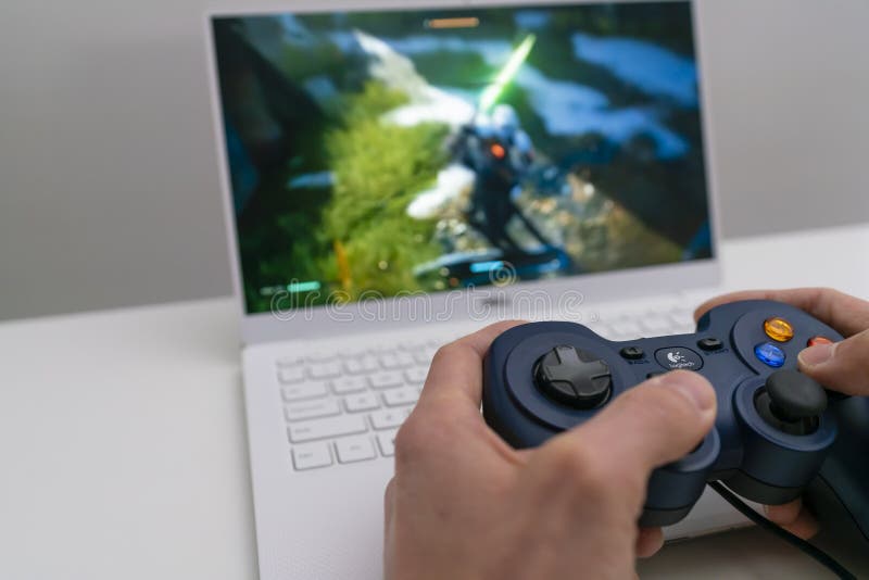 Playing Game on Laptop Computer with Joypad Editorial Image - Image of ...
