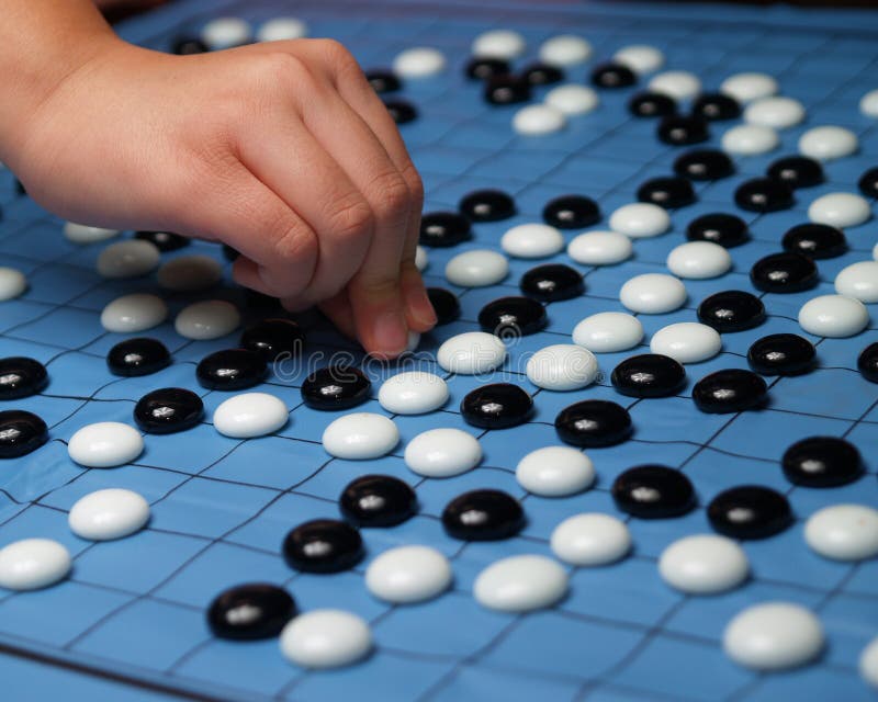 Playing go game stock photo. Image of entertainment, chess - 1584790