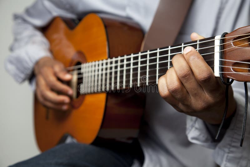 Playing acoustic guitar stock photo. Image of male, hand - 10124186